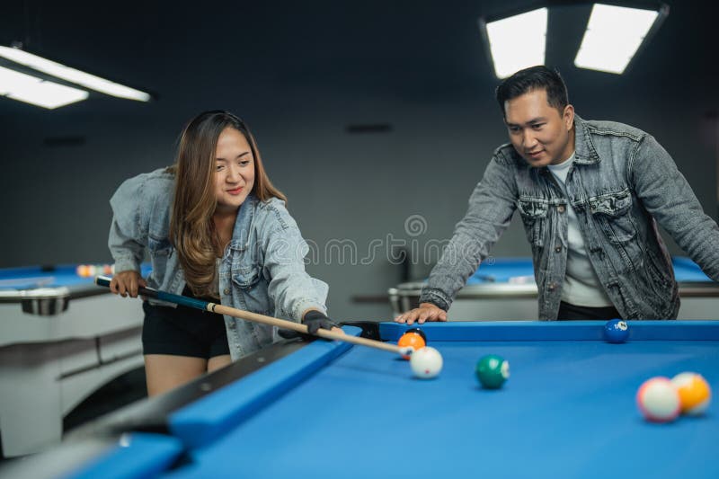 Female Pool Player Poking the White Ball Stock Image - Image of ...