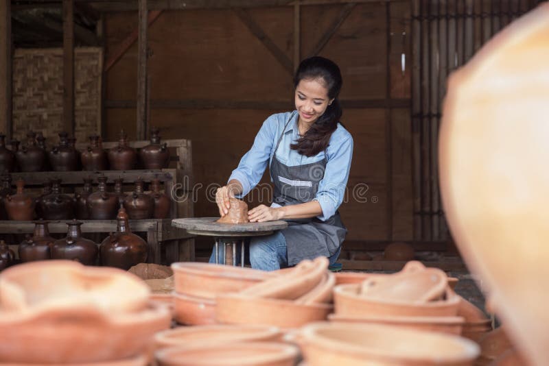 Female potter making pot stock image. Image of portrait - 82704227