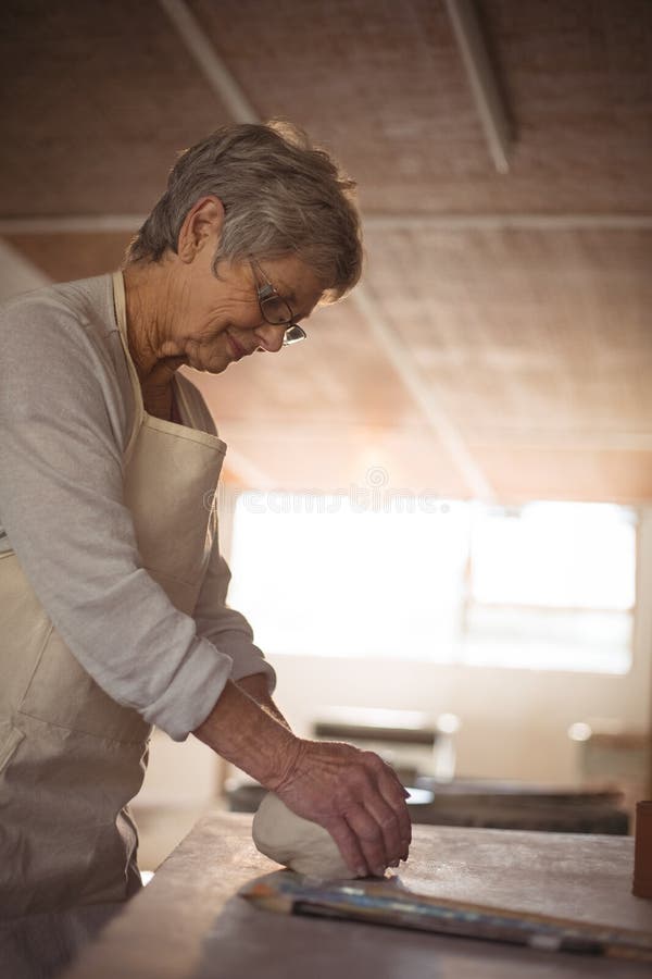 Female potter molding clay stock image. Image of molding - 75199559