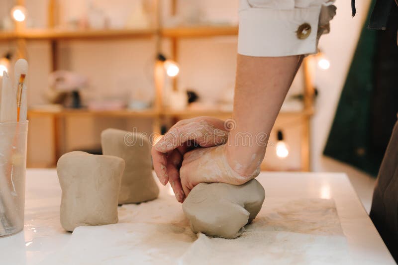 Female Potter Rolls Piece of Clay before Sculpting. Preparing Clay for ...