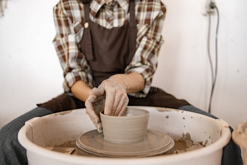 Female Potter Sculpting Ceramic Bowl on Potter S Wheel Stock Photo ...