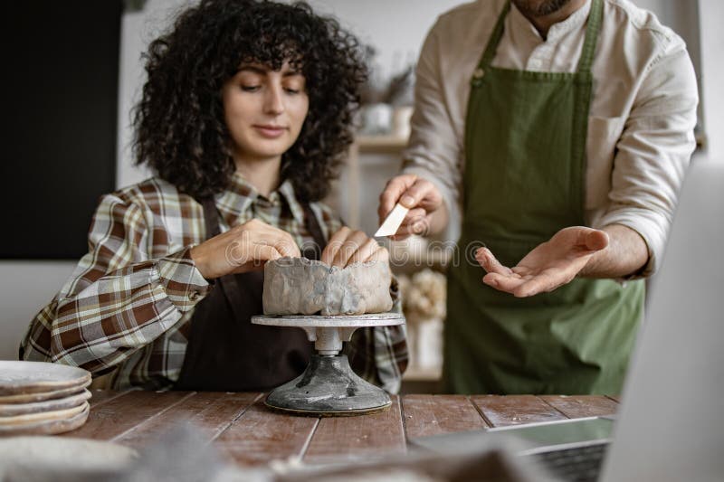Woman Learning Pottery with Instructor in Studio Stock Image - Image of ...