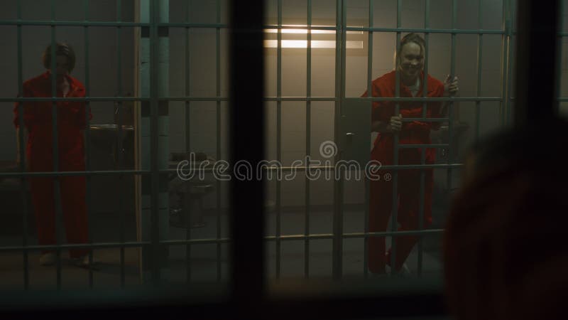 Female Prisoner in Orange Uniform Shakes, Looks at Camera Stock Video ... Female Prisoner in Orange Uniform Shakes, Looks at Camera Stock Video ...