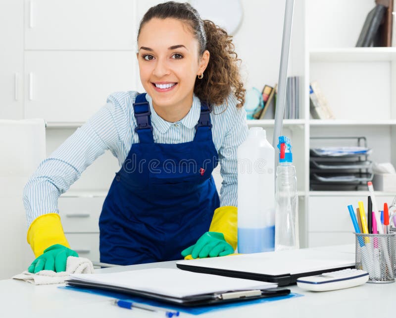 Female Professional Cleaner Dusting Table Stock Photo - Image of ...