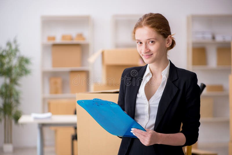 Young Female Professional Mover Doing Home Relocation Stock Image ...