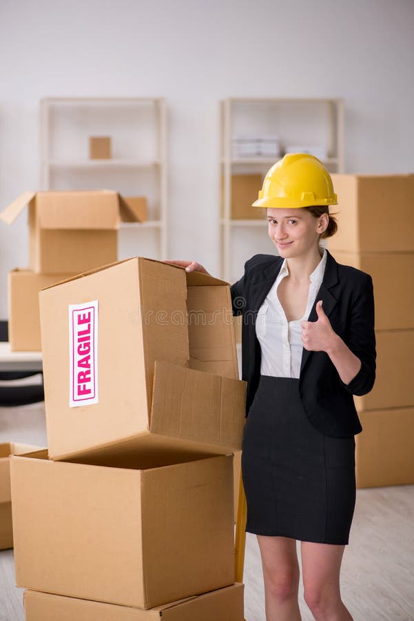 Young Female Professional Mover Doing Home Relocation Stock Photo ...
