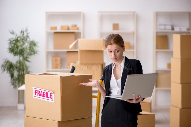 Young Female Professional Mover Doing Home Relocation Stock Photo ...