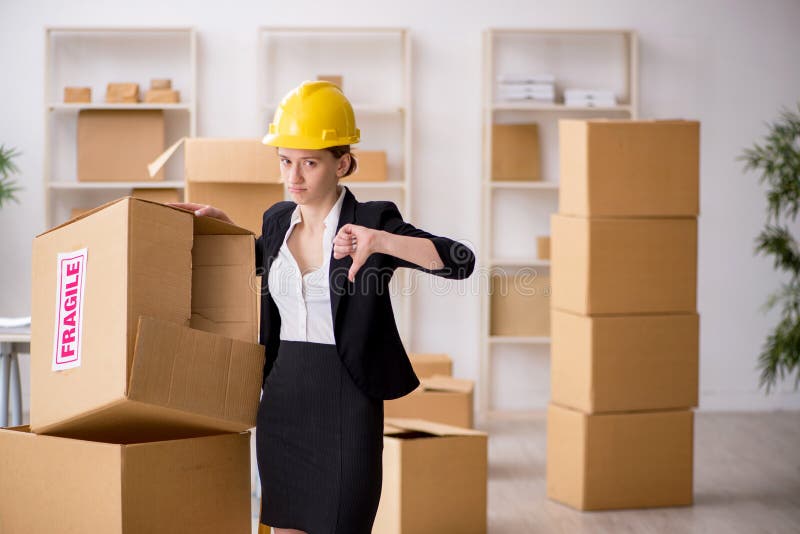 Young Female Professional Mover Doing Home Relocation Stock Photo ...