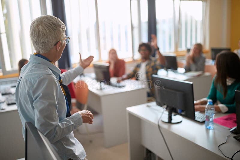 Female Professor Answering Student`s Question at an Informatics Lecture ...