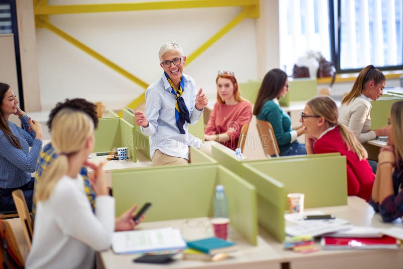 Female Professor Enjoying in a Discussion with Students Stock Image ...
