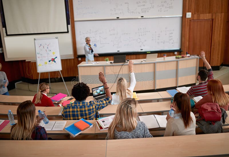 Female Professor Explaining the Lesson To Students at a Lecture Stock ...