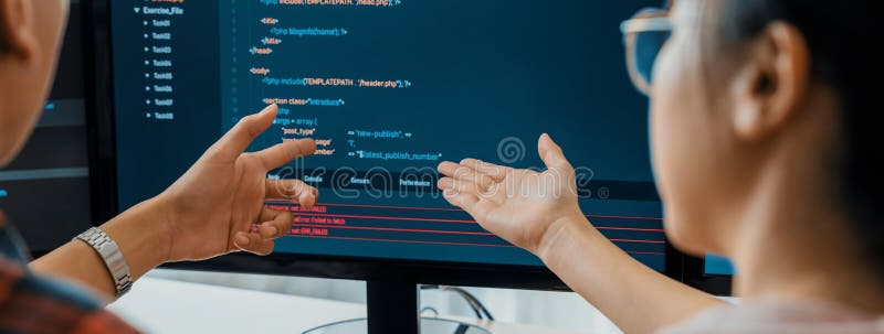 Female Programer Explain While Pointing Code Displayed On Computer