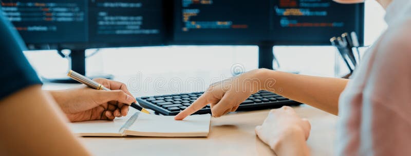 Female Programer Taking a Note while Web Developer Present Program. Burgeoning. Stock Photo ...