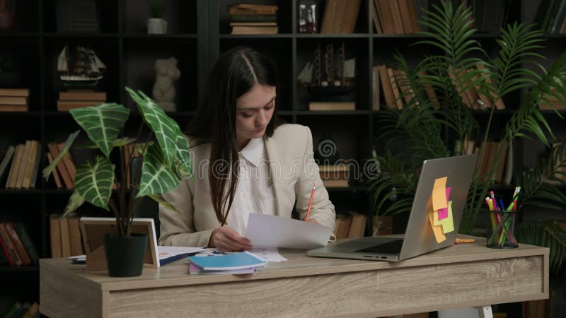 Female it Programmer Analyzes a Task she Has To Complete. Woman in ...