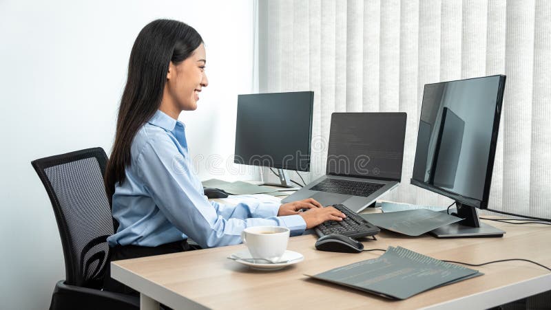 Female Programmer Using Multiple Monitor Screen To Development Business Website while Working To ...