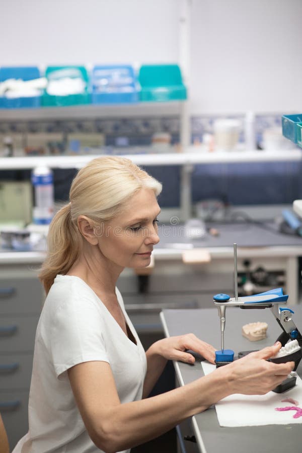 A Female Prosthetist Wraps a Plaster Cast Around the Leg Stump & X28 ...