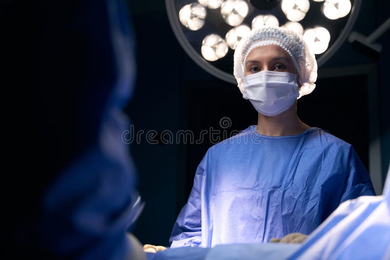Female in Protective Mask and Uniform Stands at Operating Table Stock ...