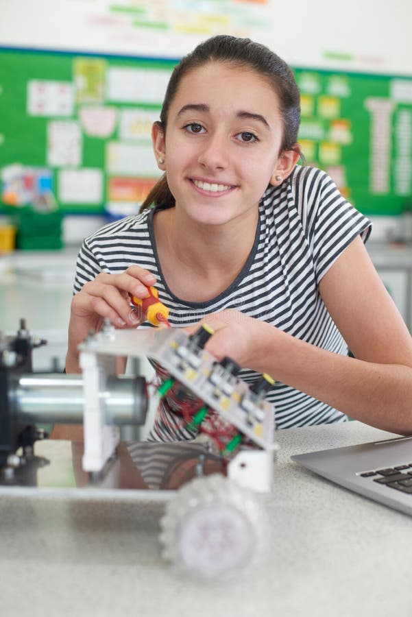 Portrait of Female Pupil in Science Lesson Studying Robotics Stock ...