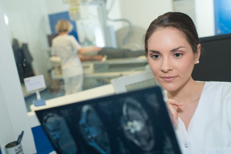 Female Radiologist Examining Brain Scan by Mri Machine Stock Image ...