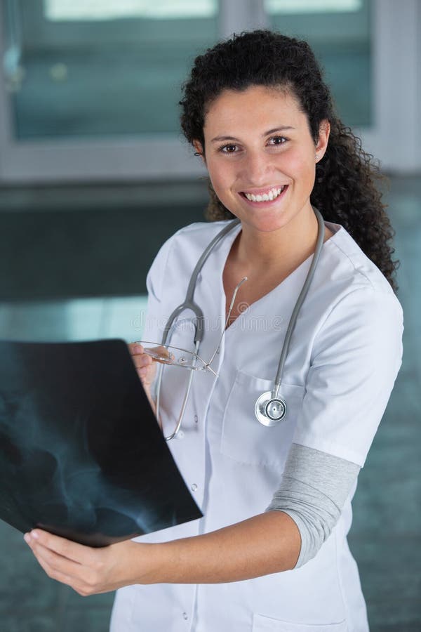 Female Radiologist Holding X-ray Stock Image - Image of medicalperson ...