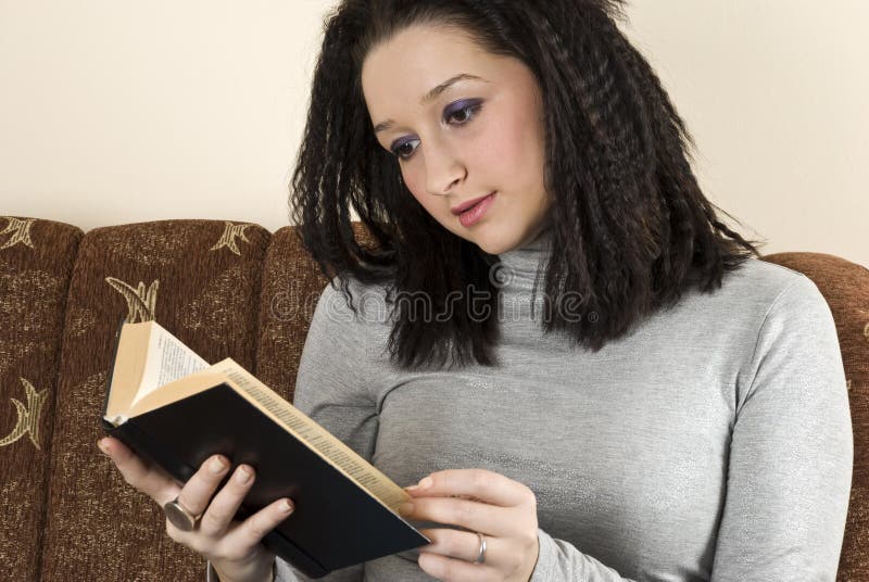 Female reading a book stock image. Image of living, holding - 12224489