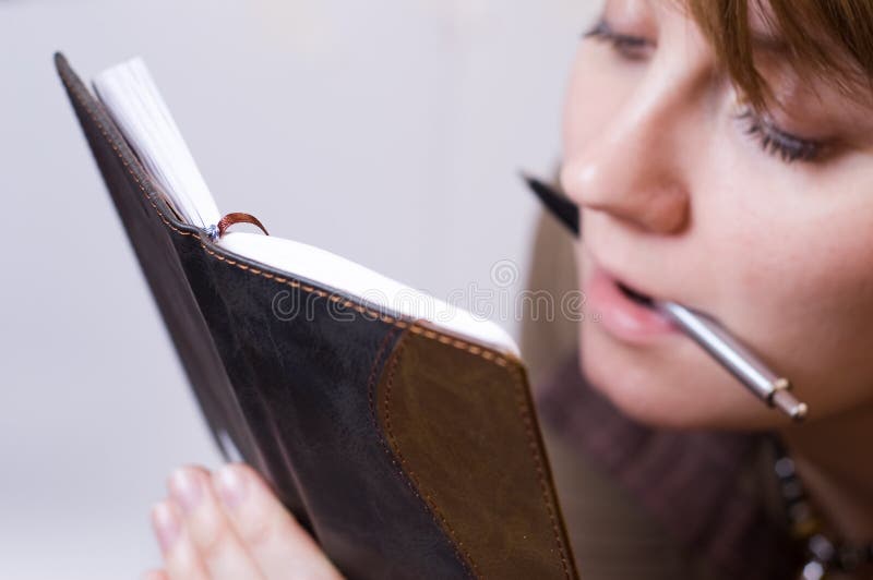 Female Reading Notes in Notebook Stock Photo - Image of indoors ...