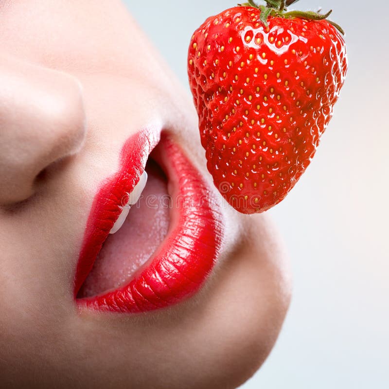 Woman tasting a strawberry stock photo. Image of finger - 47652