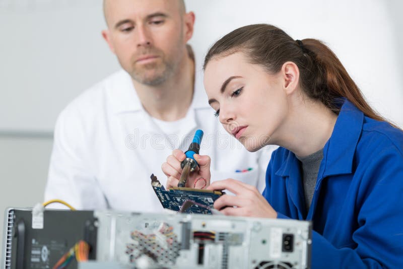 Female Repairing Computer in Technical School Stock Image - Image of ...