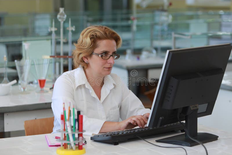 Female Researcher Using Automated Immunoassay System in Lab Stock Image ...