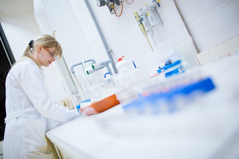 Female Researcher Using Automated Immunoassay System in Lab Stock Image ...