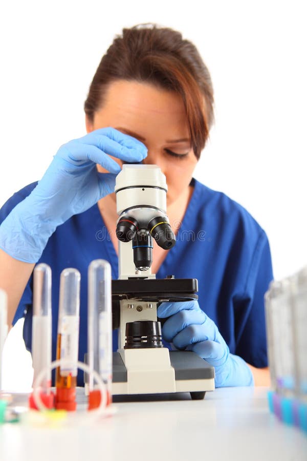 Female Researcher Looking into a Microscope Stock Image - Image of ...