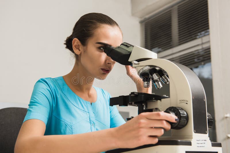 Female Researcher with a Microscope Stock Photo - Image of instrument ...