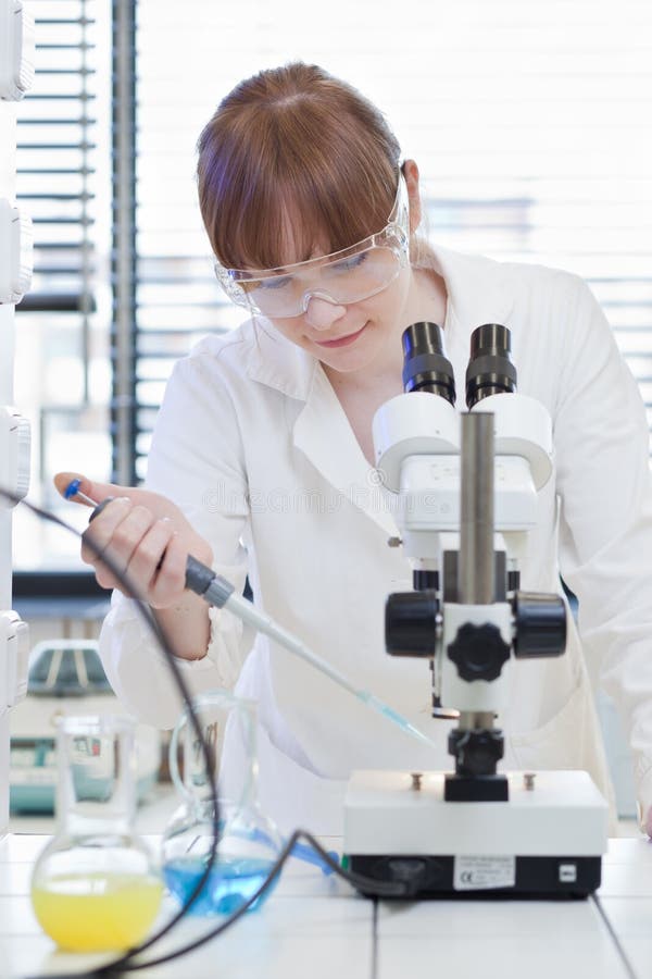 Female Researcher Using A Microscope Stock Image - Image of ...