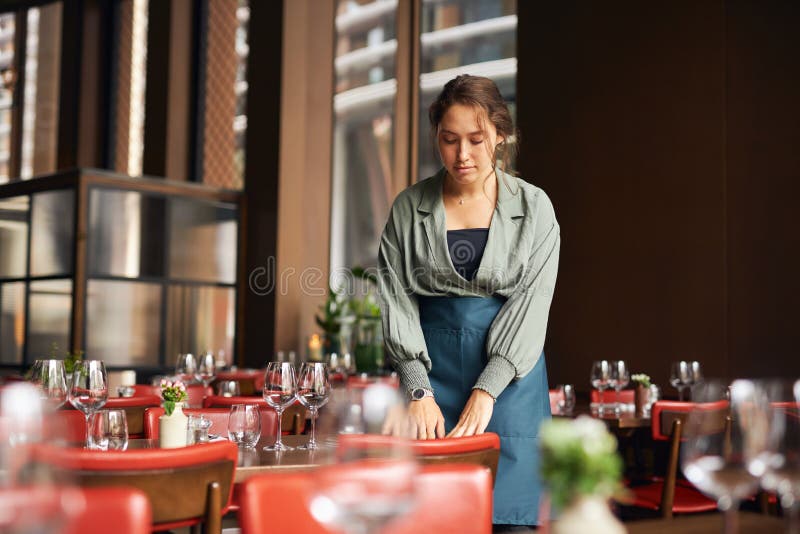 Female Restaurant Owner Setting Tables Stock Image - Image of portrait ...