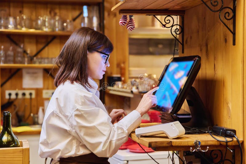 Female Restaurant Worker Using Computer Terminal while Serving ...