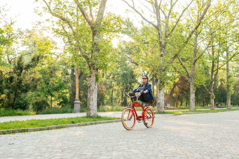 Female riding bicycle stock photo. Image of street, outdoor - 80671302
