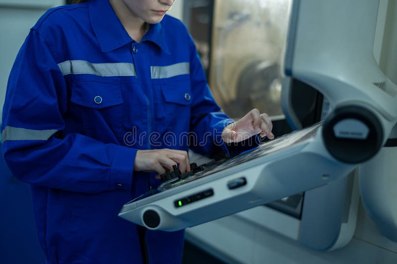 Female Robotics Engineers Using Controller To Remotely Operate Programming and Manipulating ...