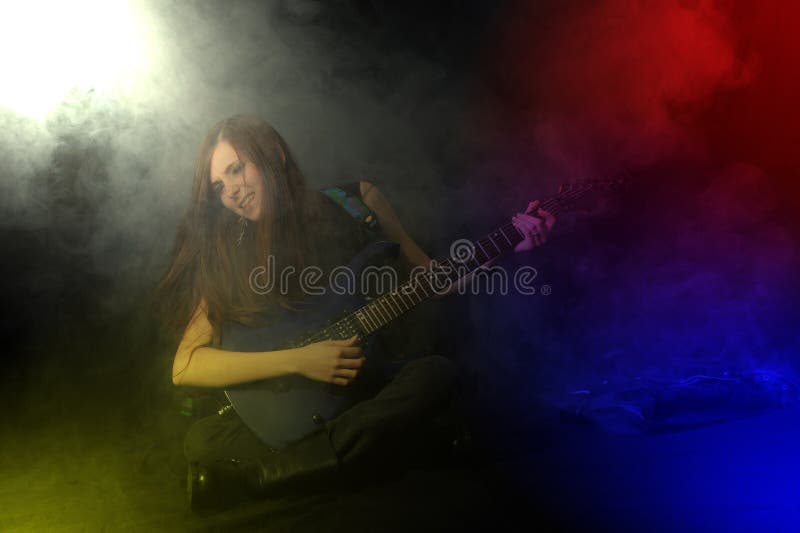 Female Rock Star Playing the Guitar Stock Image - Image of wall, sound ...