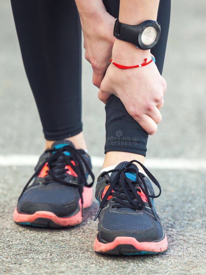 Female Runner is Holding Her Injured Leg. Stock Photo - Image of rest ...