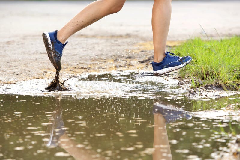 Female Runner Legs Running in Mud Stock Image - Image of path, foot ...