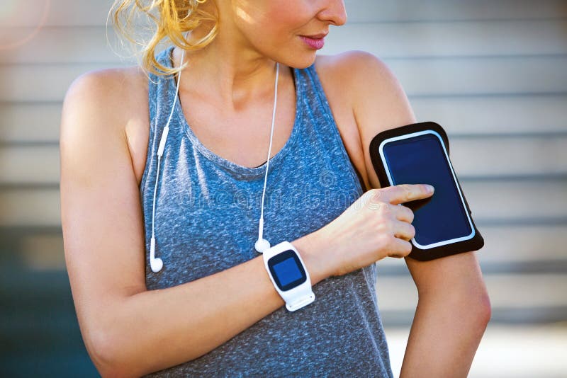Female Runner with Mobile Phone and Smart Watch Stock Image - Image of ...