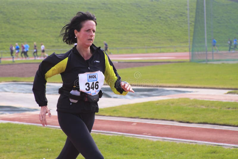 Female Runner Near the Finish Editorial Photo - Image of outdoor ...