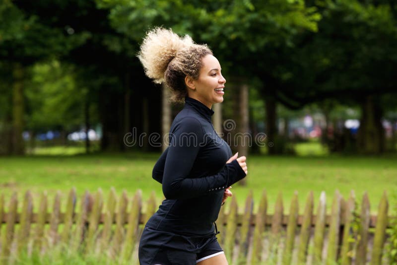 Female Runner Outside Smiling Stock Image - Image of african, active ...