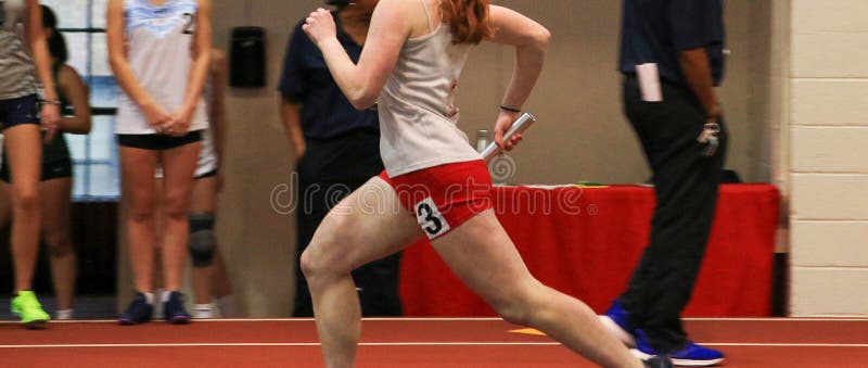 Female Runner Running Fast on an Indoor Track Stock Image - Image of ...