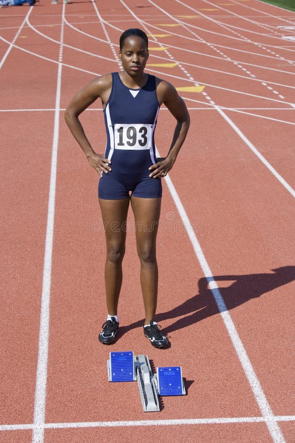Female Runner Crouching in Portico Stock Image - Image of olympics ...