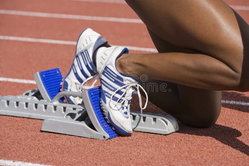 Female Runner on Starting Blocks Stock Photo - Image of challenge ...