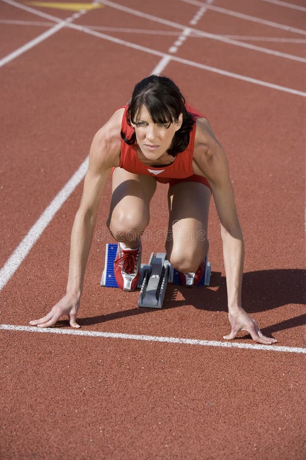 Female Runner at Starting Line Stock Photo - Image of people, racetrack ...