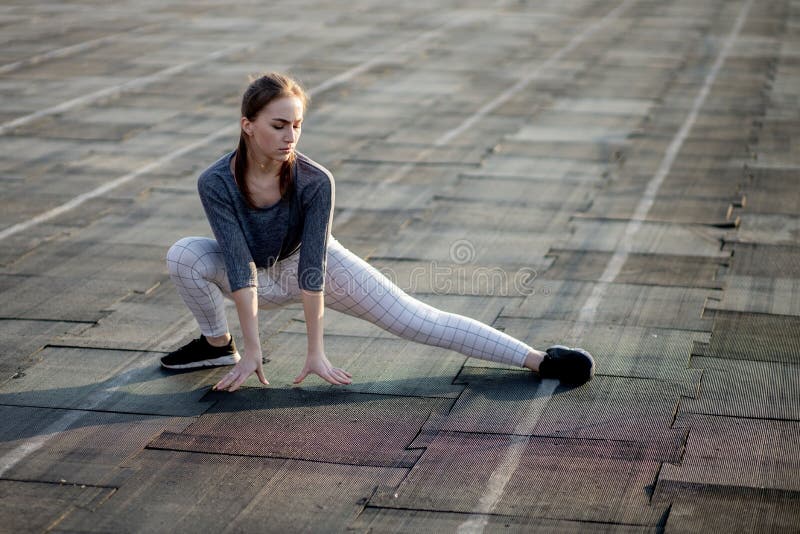 Female Runner Stretching Legs on Running Track Stock Image - Image of ...