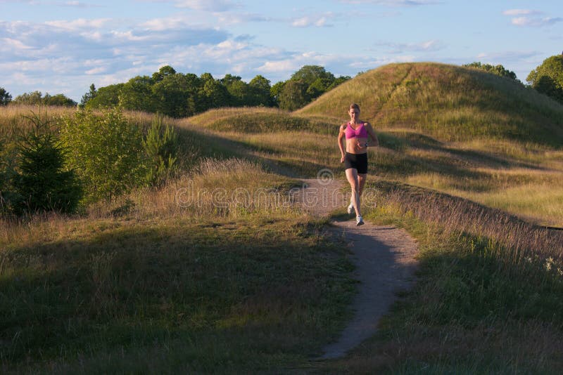 Female Runner in a Stunning Summer Landscape Stock Image - Image of ...