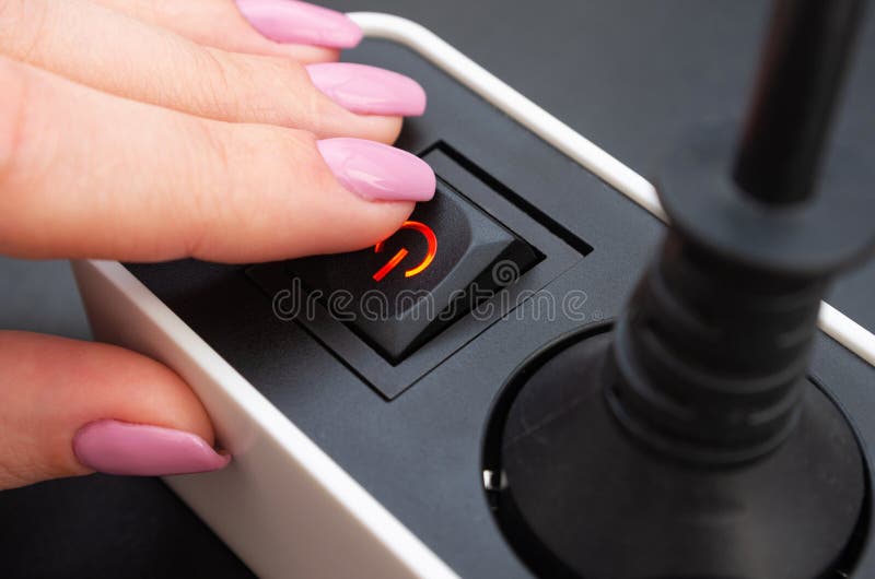Female S Hand Pressing the Power Button on Multiple Socket Outlet ...
